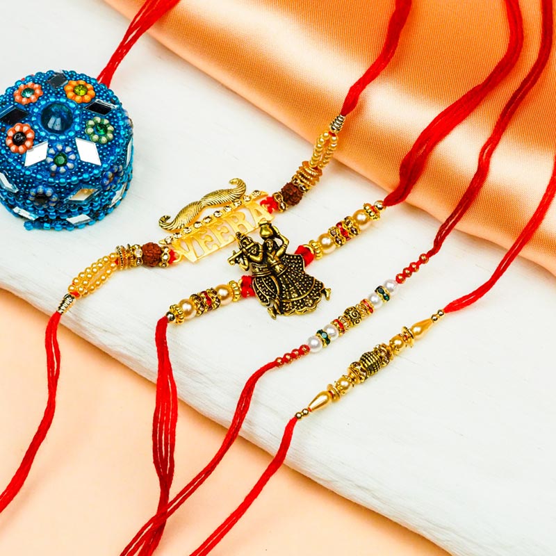 Send Pearl, Radha Krishna & Veera Set of 4 Rakhis Online | Rakhibazaar.com
